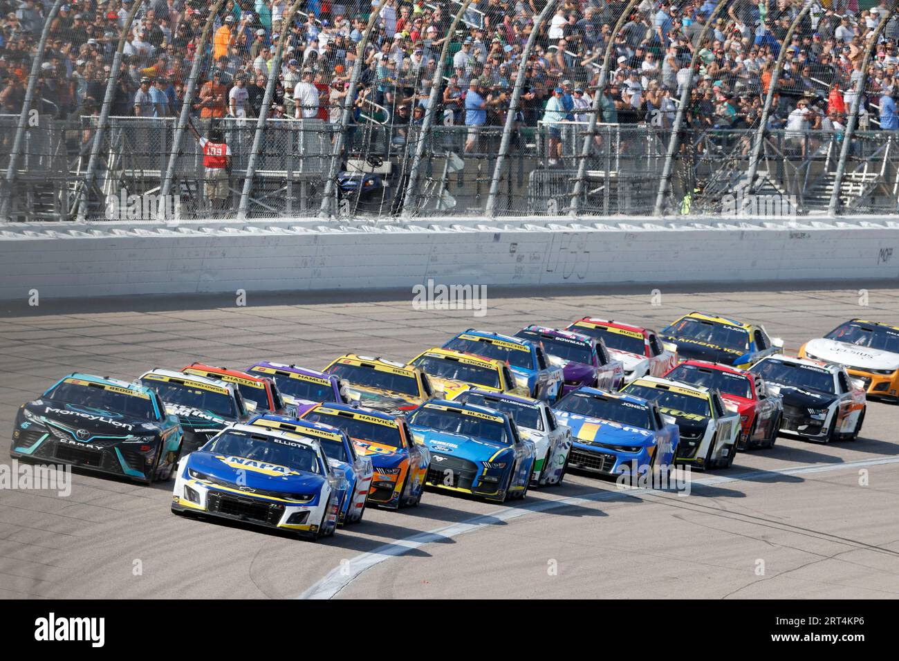 Drivers head into Turn 1 during a NASCAR Cup Series auto race at Kansas ...