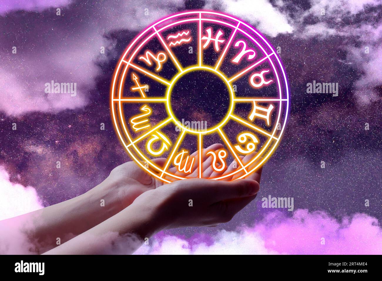 Astrology. Woman holding zodiac wheel against starry night sky with ...
