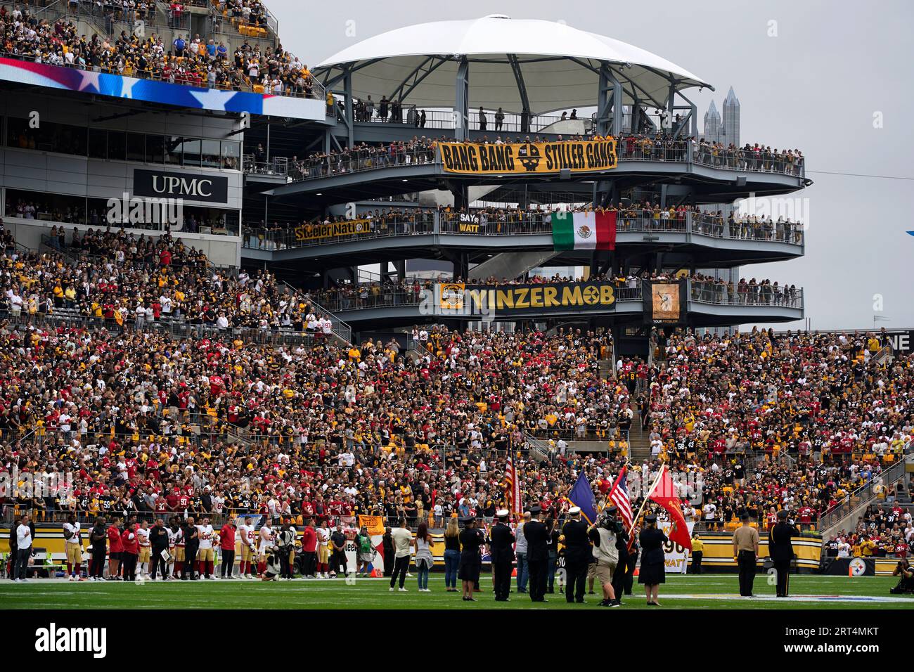 Football fans line a rotunda at Acrisure Stadium during the National ...