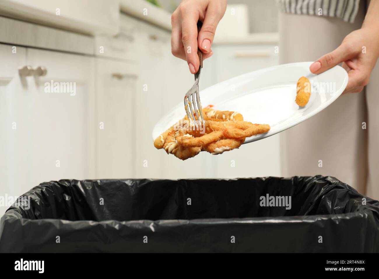 Person throwing food bin hi-res stock photography and images - Alamy