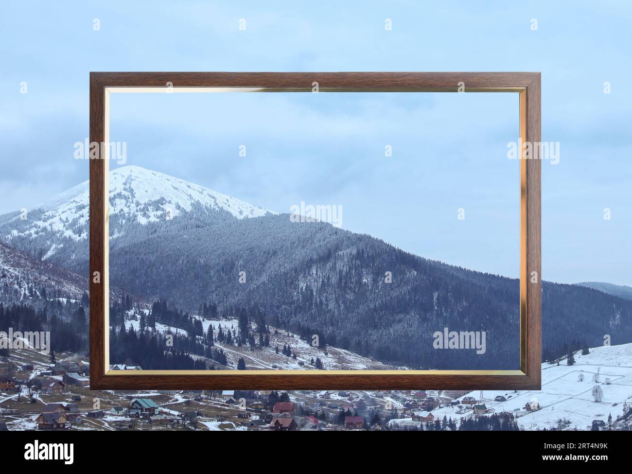 Wooden frame and beautiful mountains covered with snow in winter Stock ...