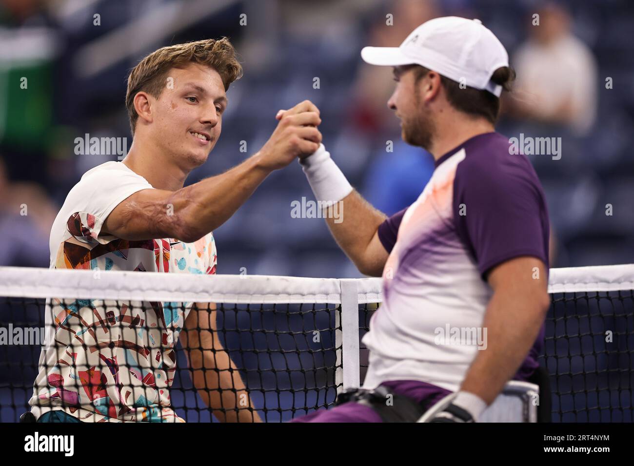 Niels Vink and Sam Schroder shake hands following a wheelchair quad ...