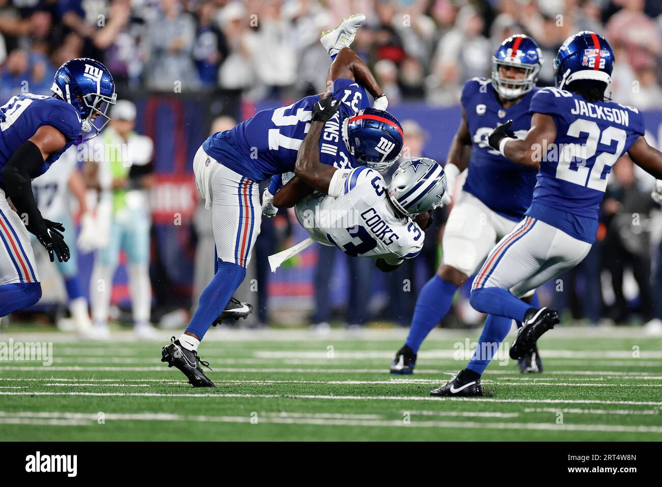 New York Giants' Tre Hawkins III (37), left, tackles Dallas Cowboys ...