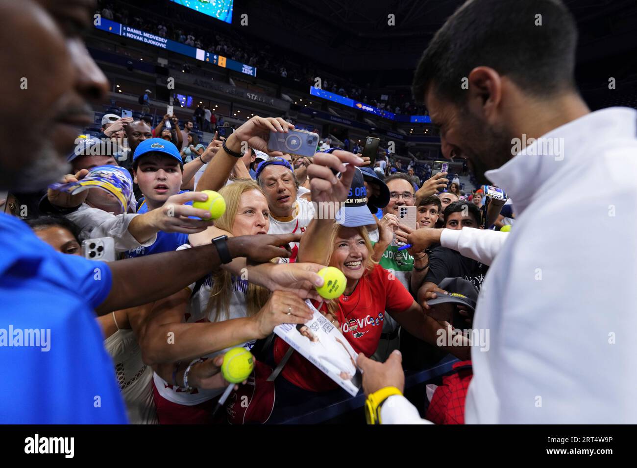 Novak Djokovic signs autographs for fans after winning a men's singles ...