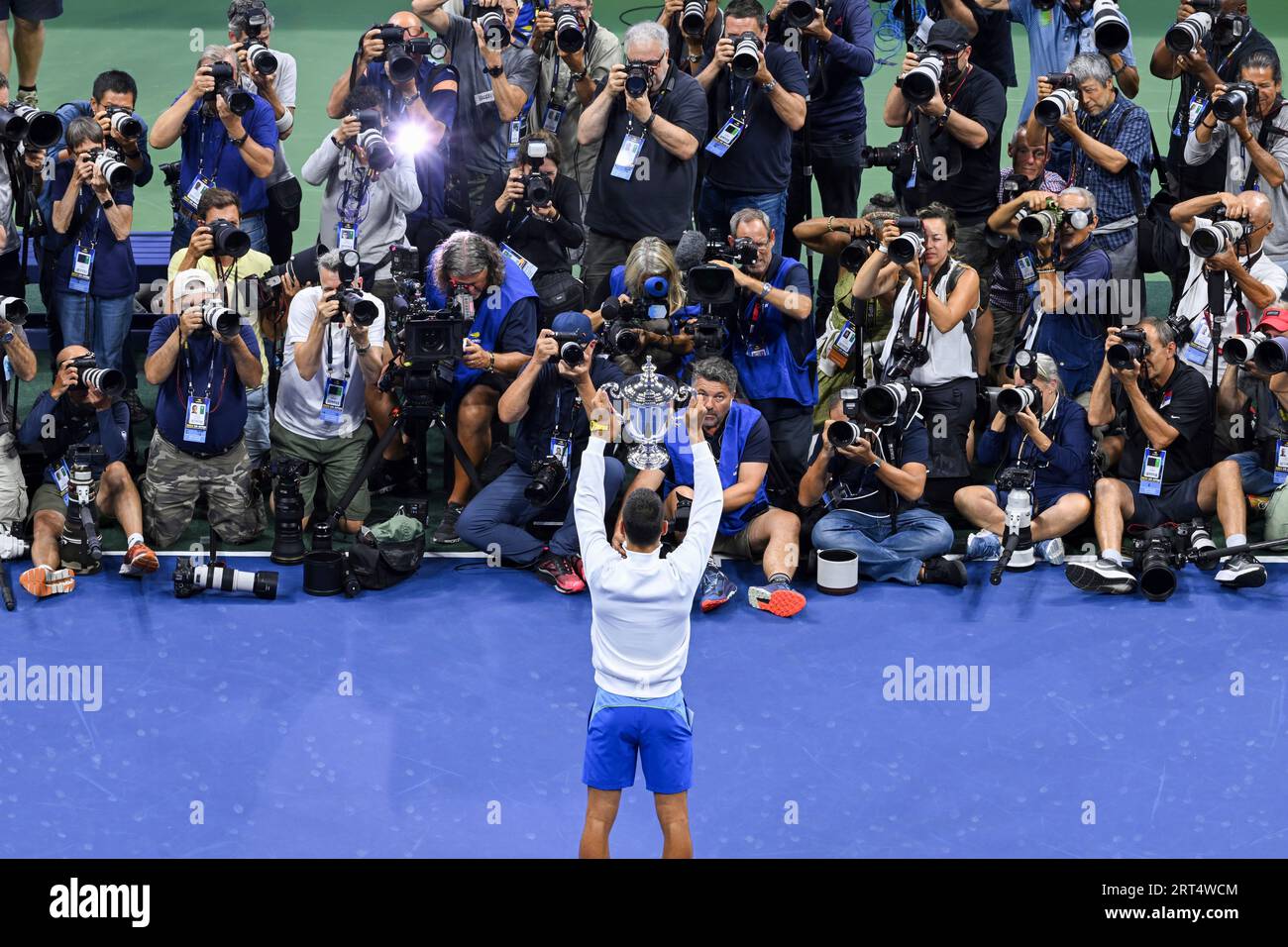 Novak Djokovic poses for a photo with the trophy after winning the men ...