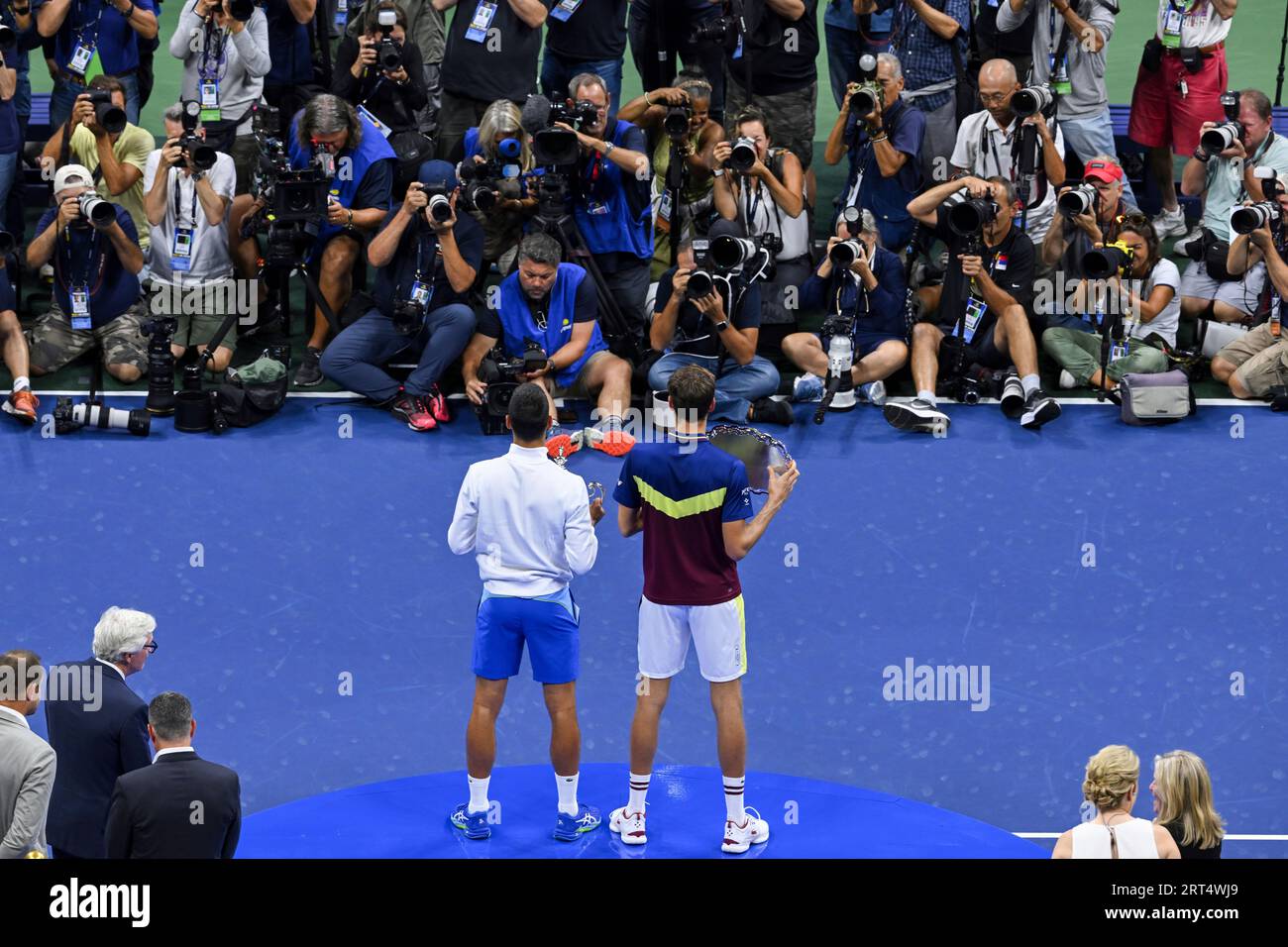 Novak Djokovic and Daniil Medvedev pose for a photo with the trophy ...