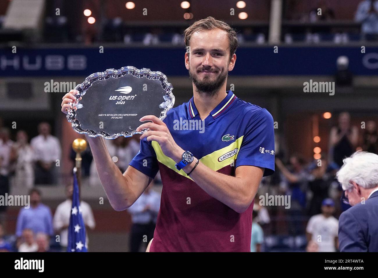 Daniil Medvedev poses for a photo with the trophy during the ceremony ...