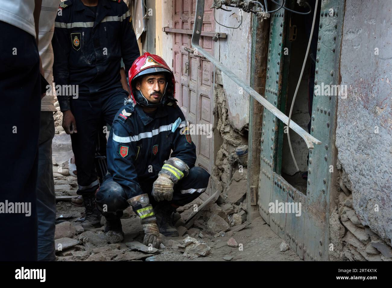 Amizmiz, Morocco. 10th Sep, 2023. A fireman rests outside a collapsed ...