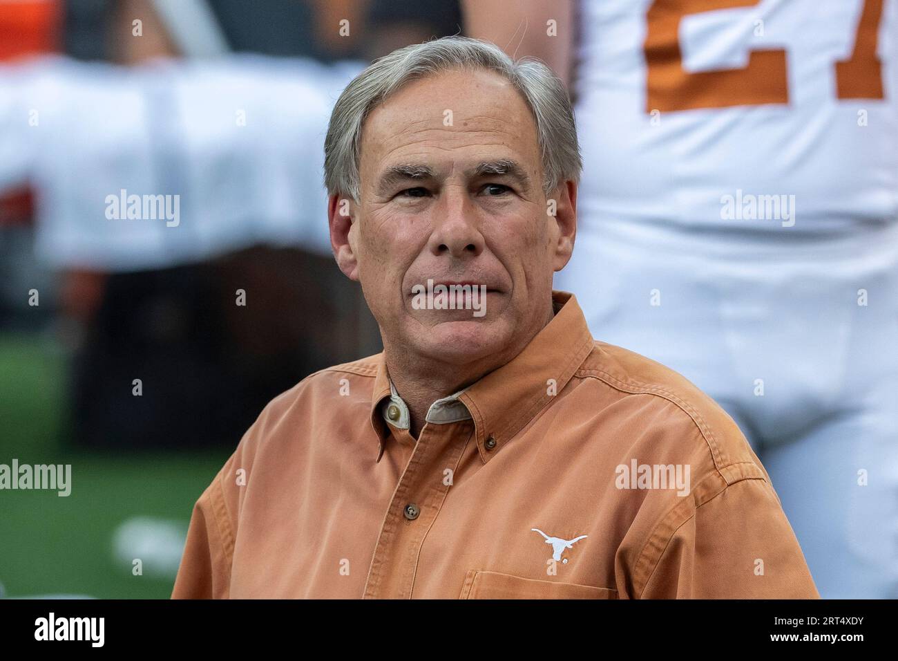 Texas Gov. Greg Abbott visits the field during warmups before an NCAA ...