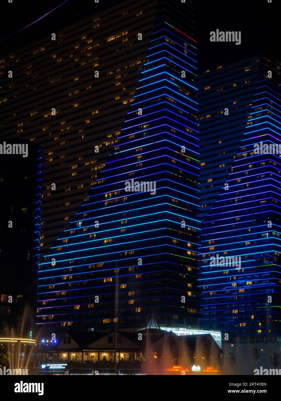 Night city in lights. High-rise buildings at the resort. Just like in ...