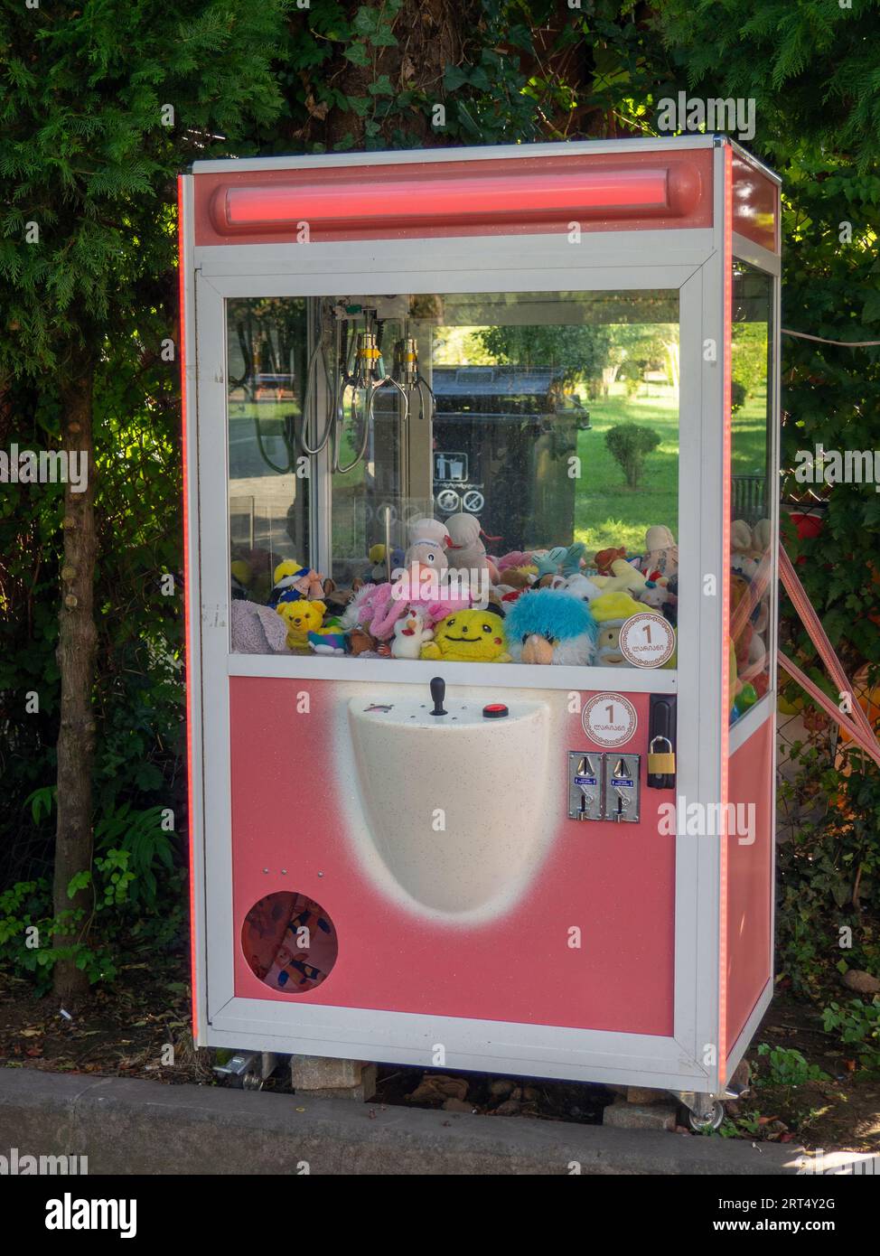 Toy dispenser. Game machine. Entertainment. Leisure fun. Take a plush ...