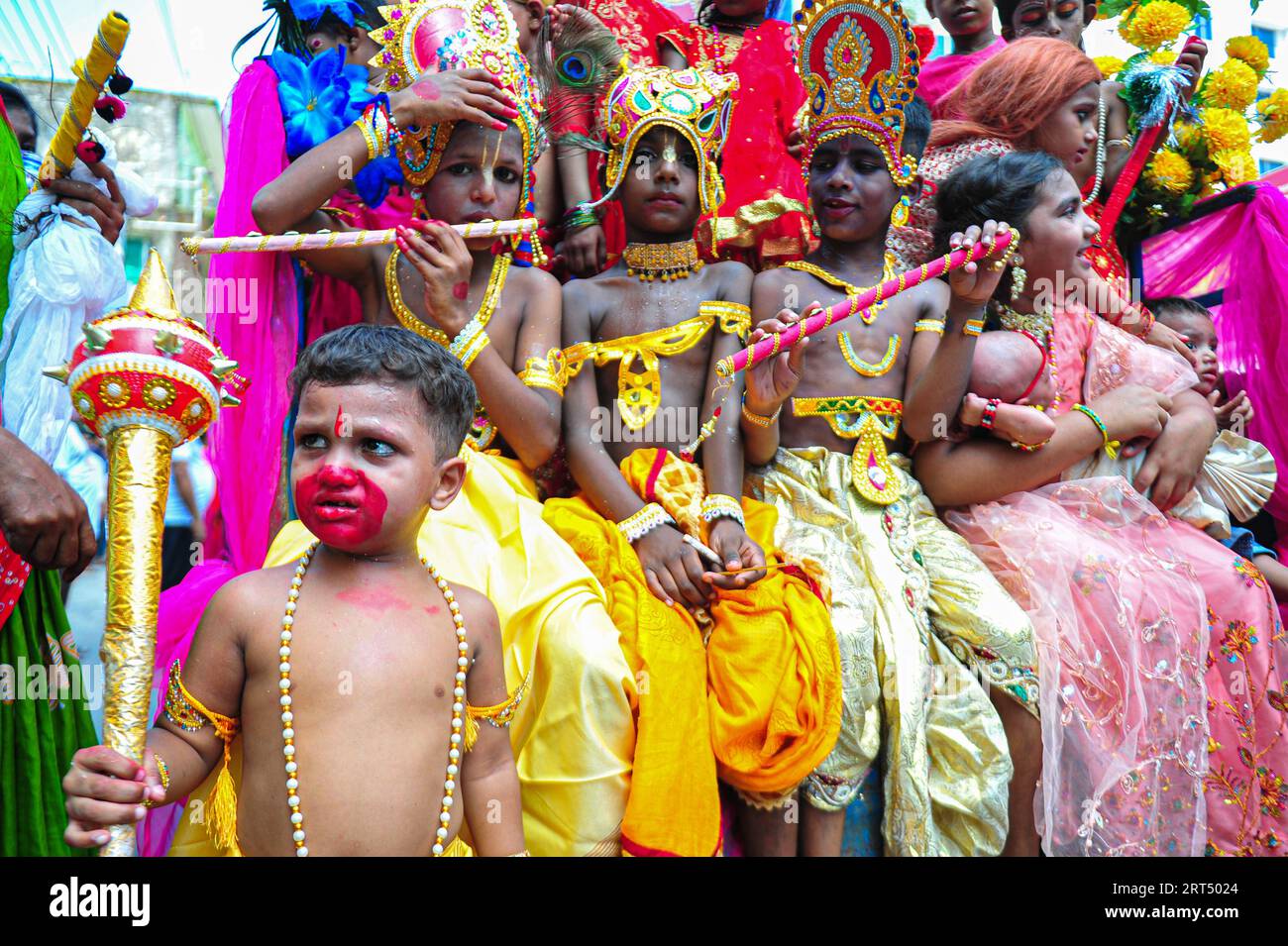 Young Children dress up as Radha and Krishna during the colorful rally ...