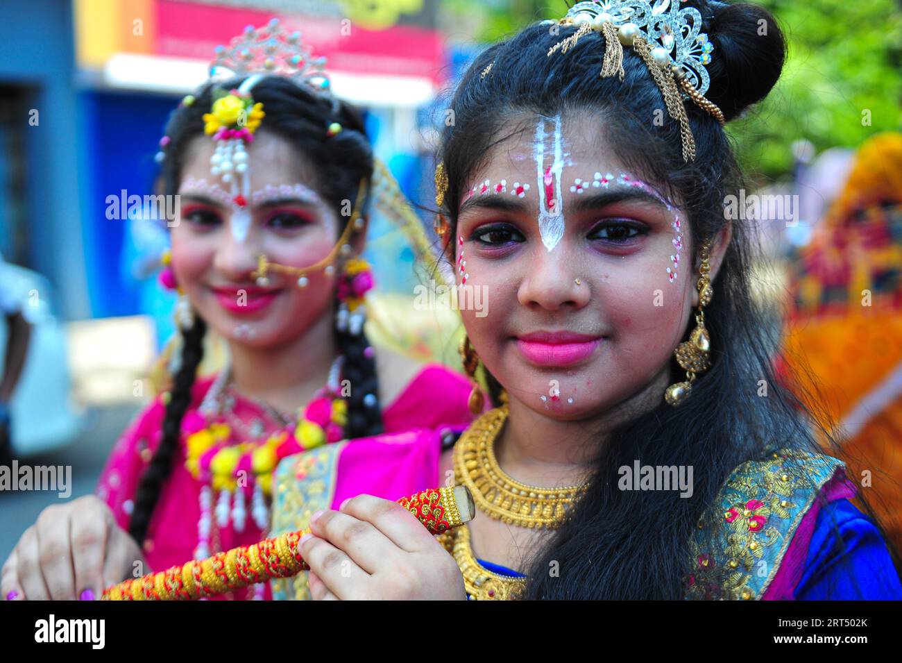 Young girls dress up as Radha and Krishna during the colorful rally of ...