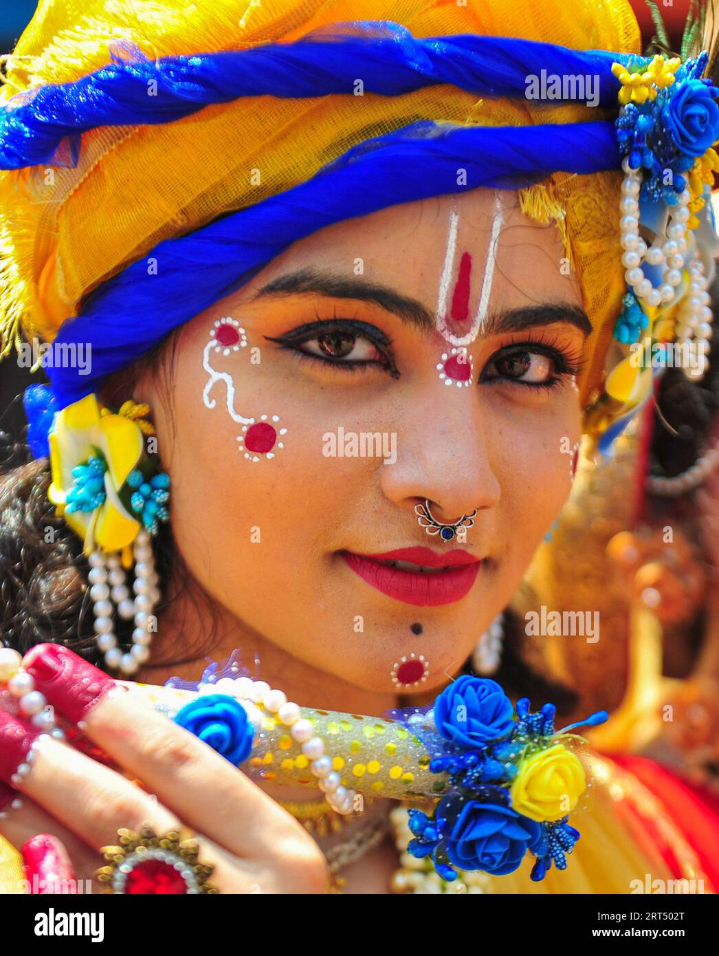 Young girls dress up as Radha and Krishna during the colorful rally of ...