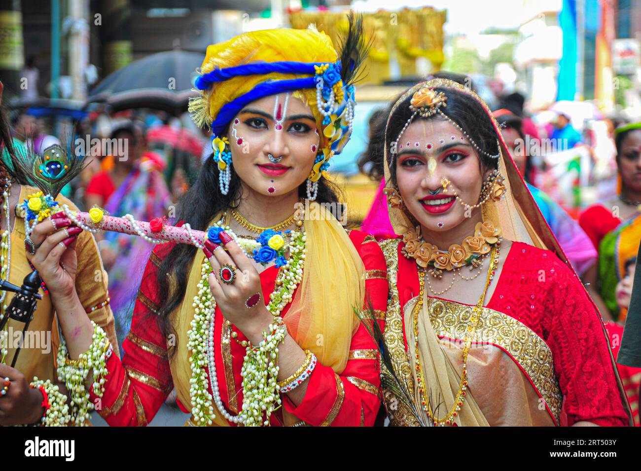 Young girls dress up as Radha and Krishna during the colorful rally of ...