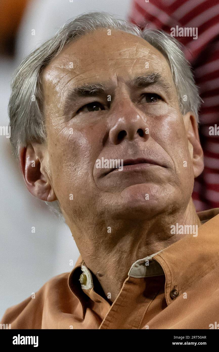 Texas Gov. Greg Abbott visits the field during an NCAA college football ...
