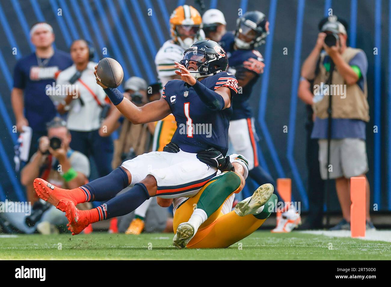 Chicago Bears quarterback Justin Fields (1) is tackled by Green Bay ...
