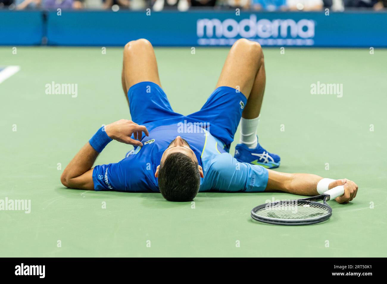 New York, USA. 10th Sep, 2023. Novak Djokovic of Serbia falls on court ...
