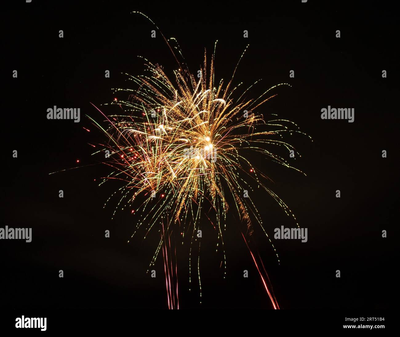 celebrating multiple bright fireworks at night Stock Photo - Alamy