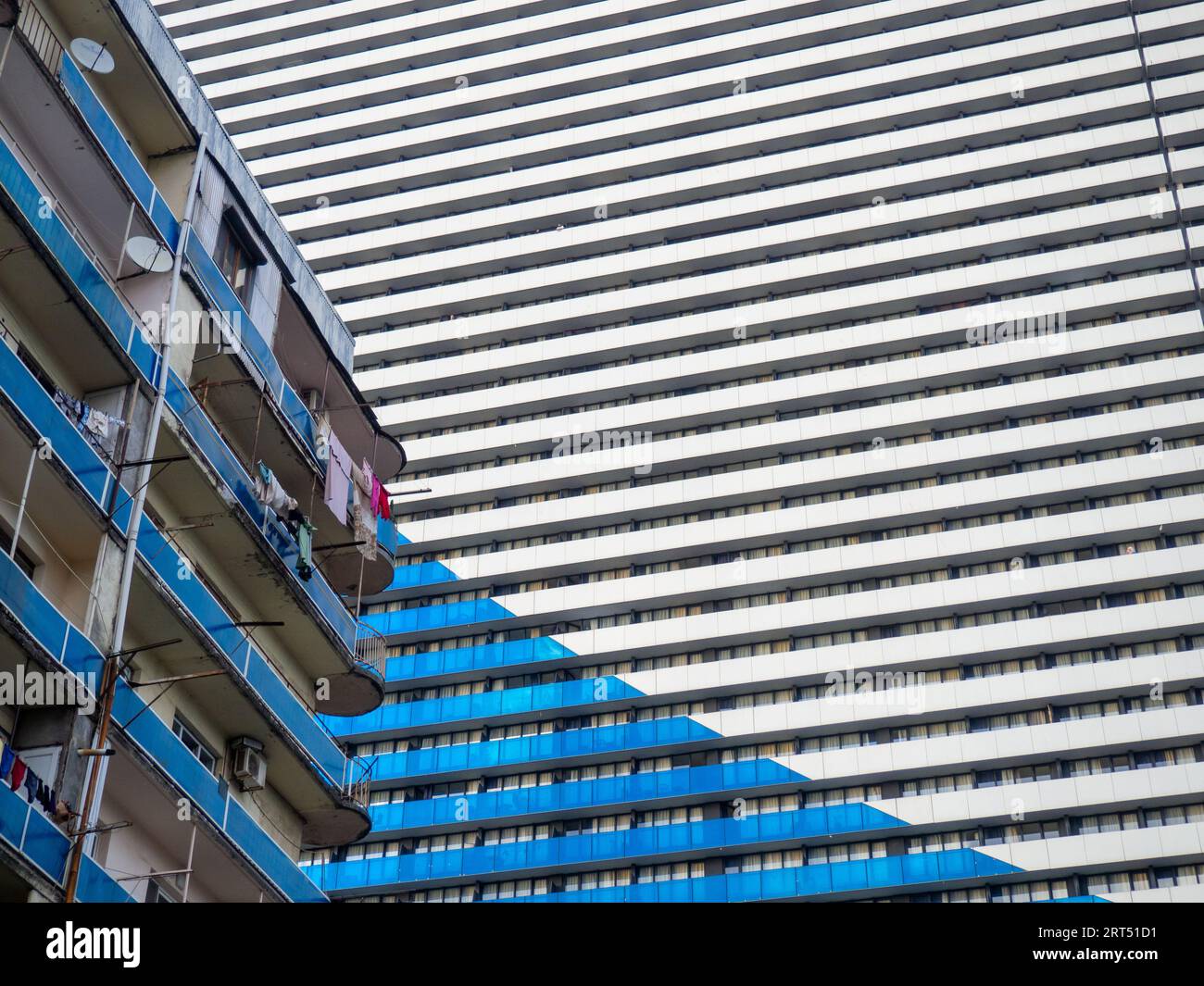Modern building and old building. Contrast of houses. New and old. Tall ...