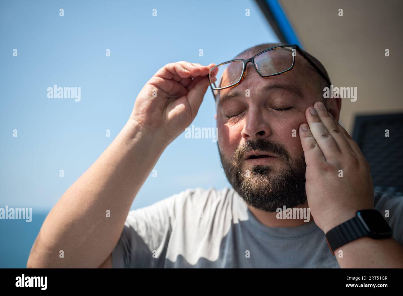 Portrait of overweight man suffering hyperhidrosis, high sweating in ...
