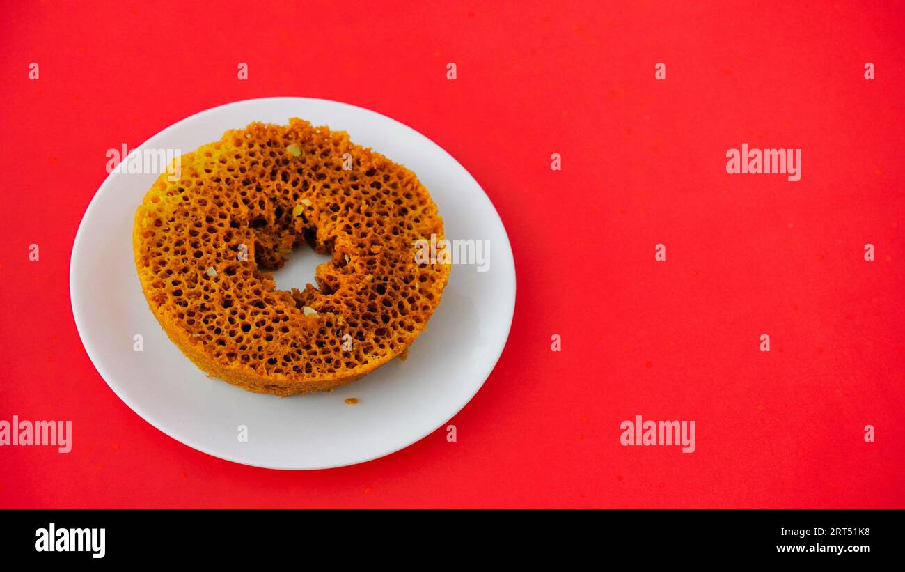 Indian Rajasthani crunchy sweet dish called Ghevar or Ghewar is an made ...