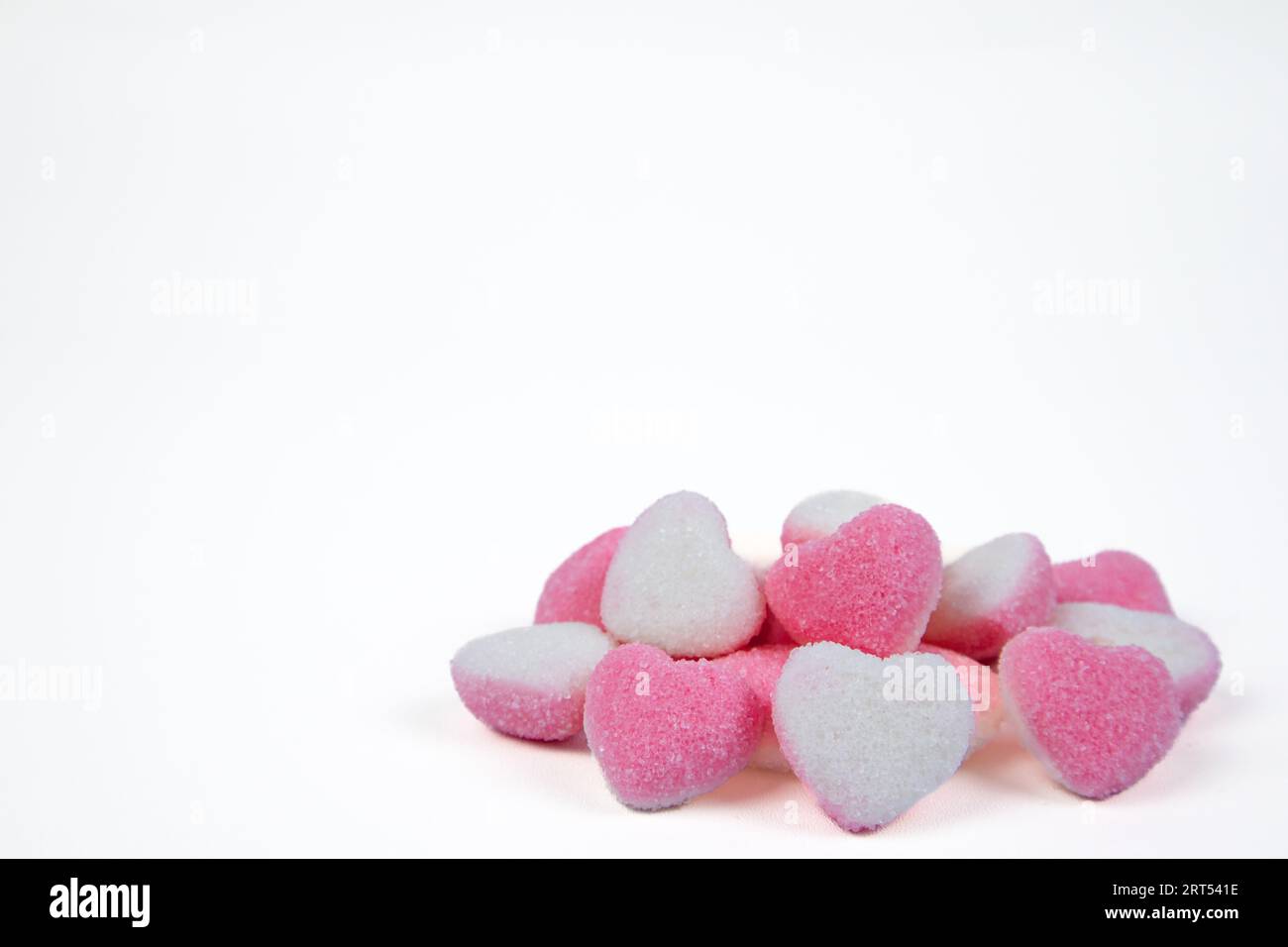 pile of heart shaped sugar Candies on white background Stock Photo - Alamy