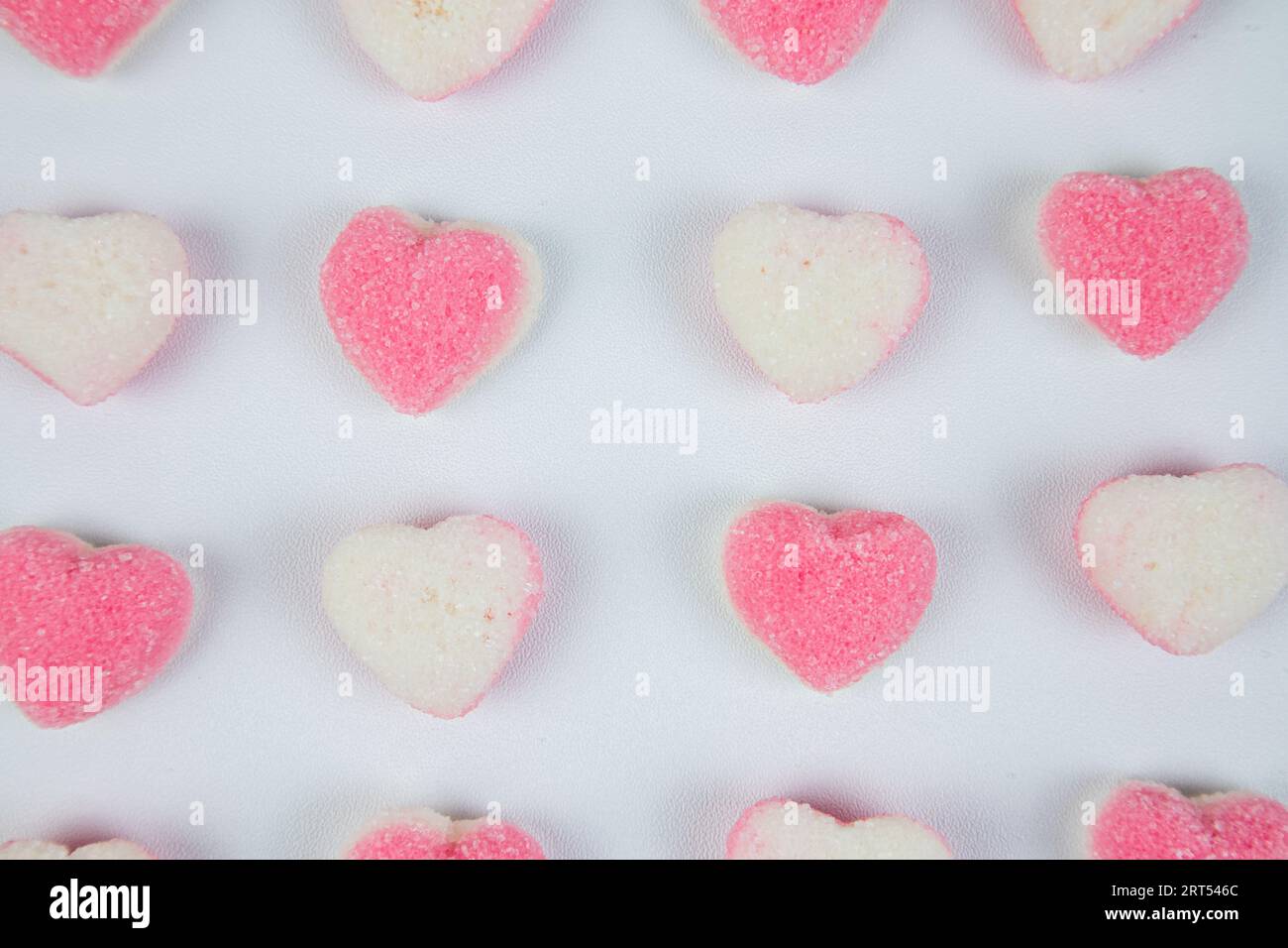 heart shaped sugar candy on white background Stock Photo - Alamy