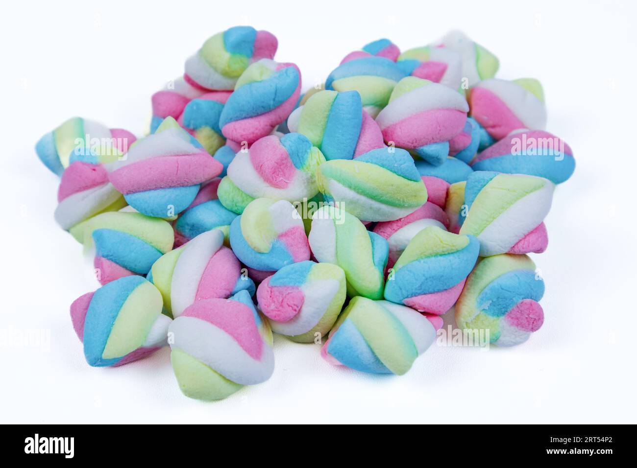 pile of marshmallow candy on white background Stock Photo - Alamy