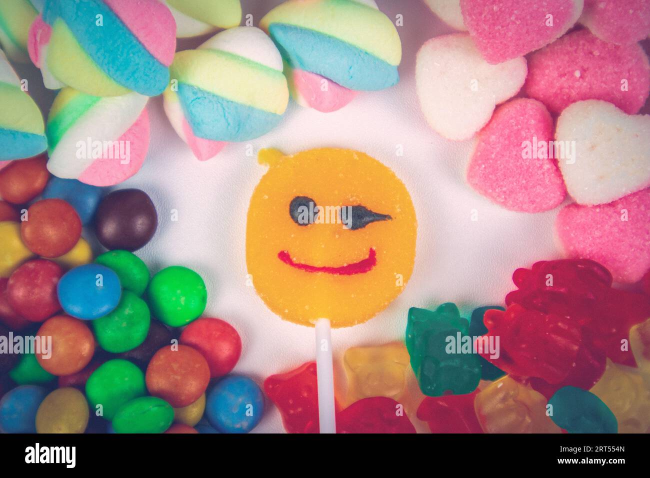piles of various kinds of sweets and candies with a focus on the ...