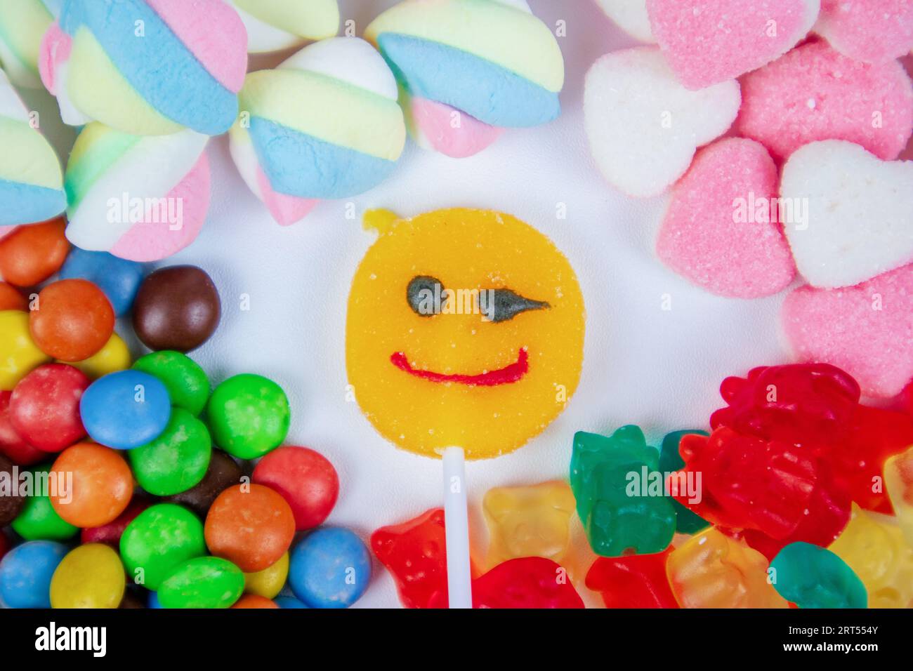 piles of various kinds of sweets and candies with a focus on the ...