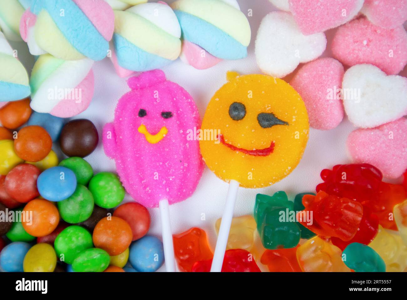 piles of various kinds of sweets and candies with a focus on the ...