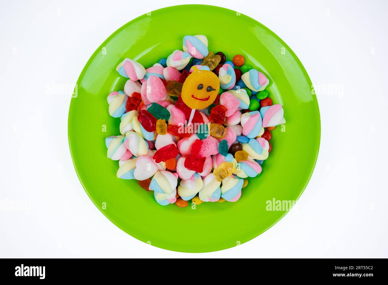 piles of various kinds of sweets and candies. Milk chocolate candy and ...