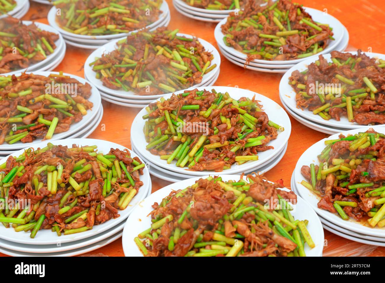 Stir fried Chinese cuttlefish with garlic sprouts Stock Photo - Alamy