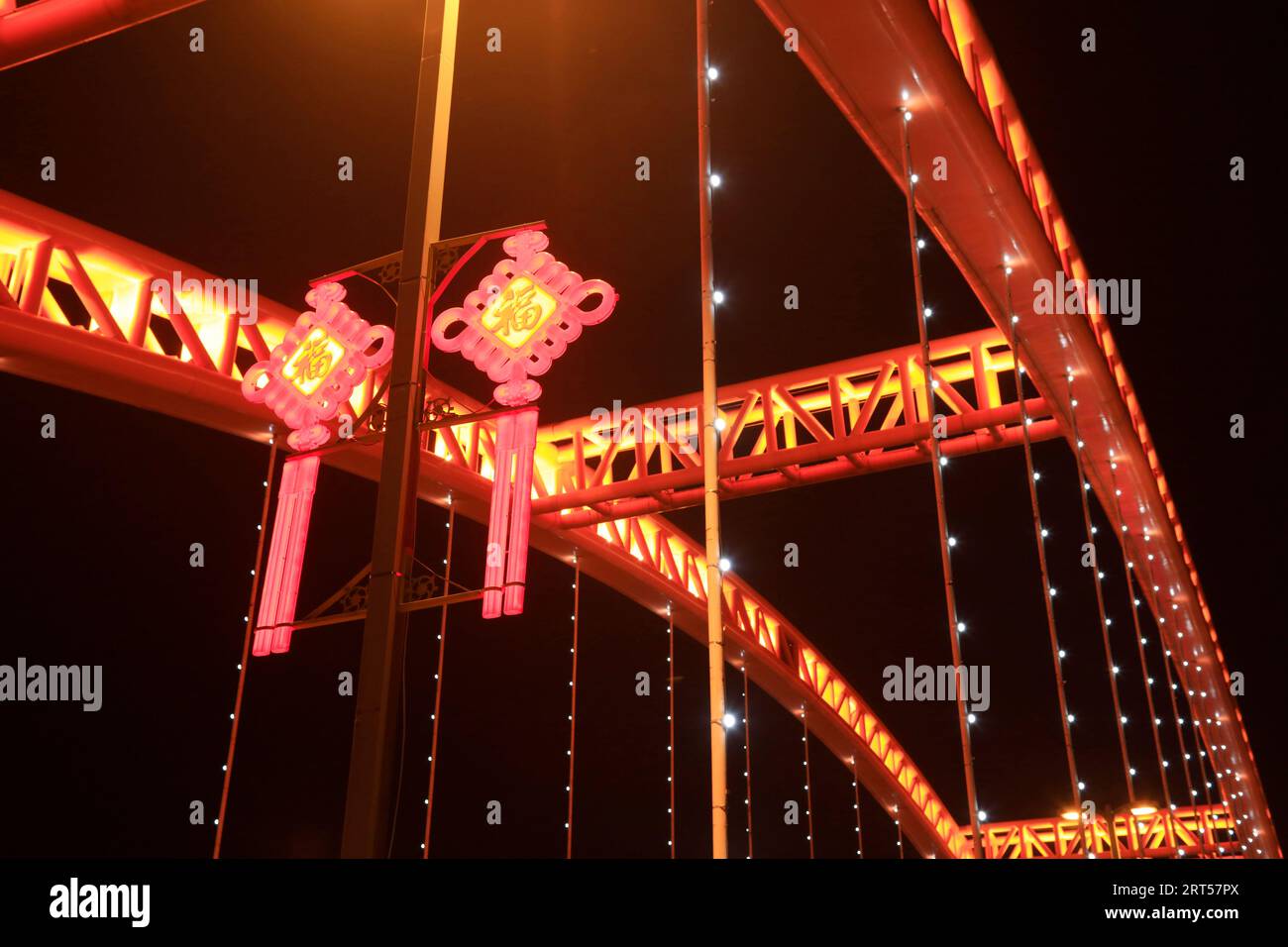 Chinese knot and Steel Bridges at Night Stock Photo - Alamy