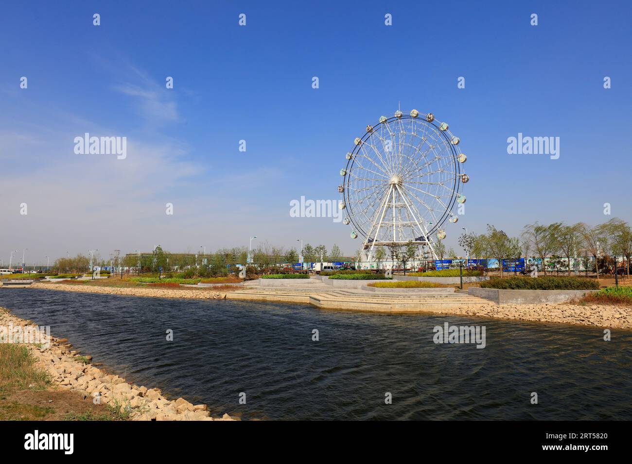 Ferris wheel in amusement park Stock Photo - Alamy
