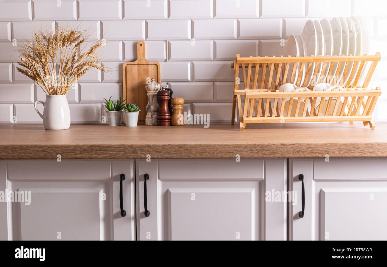 Front view of the kitchen wooden countertop with a variety of kitchen ...