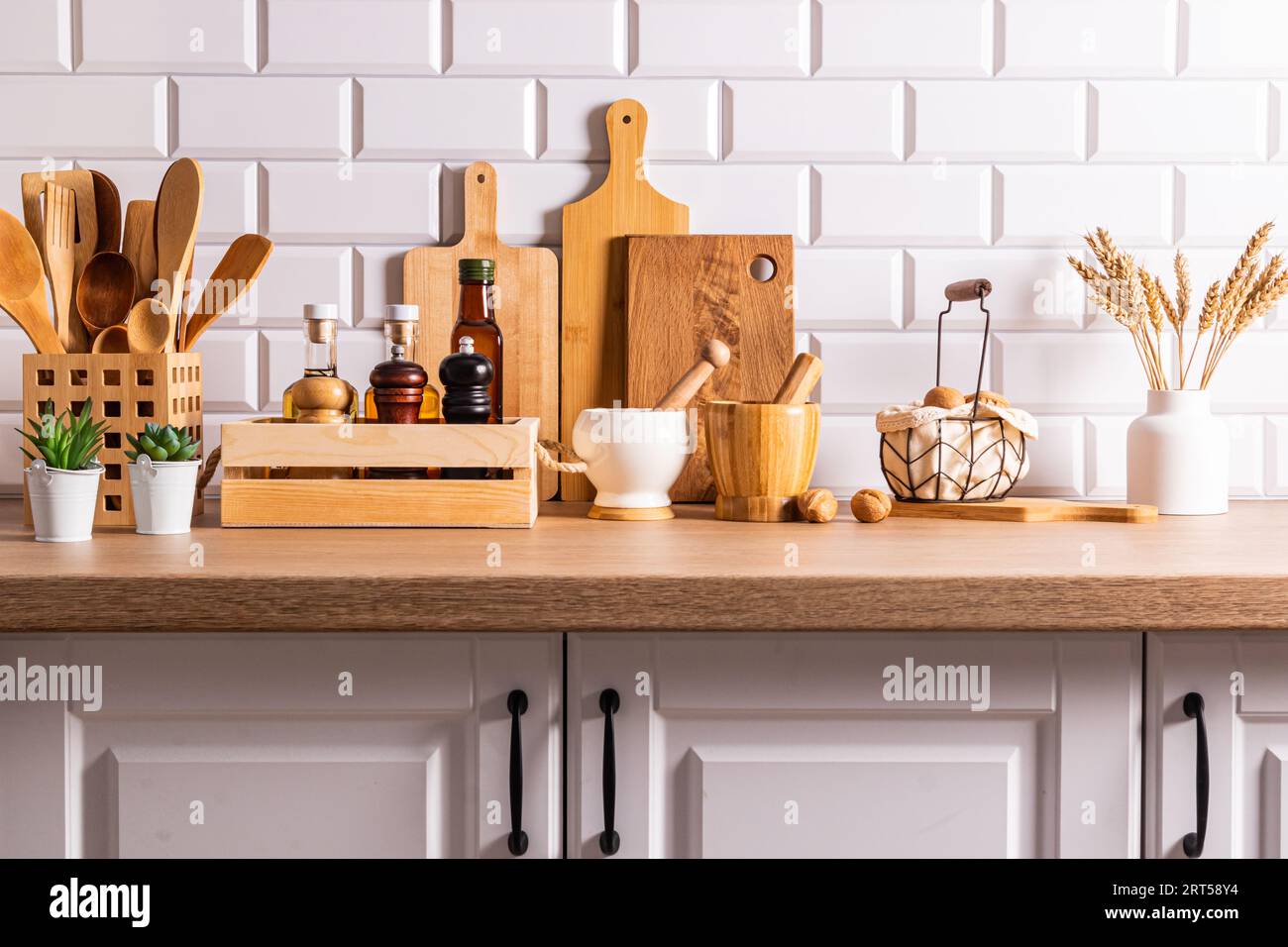 Front view of kitchen wooden countertop with a set of various kitchen ...