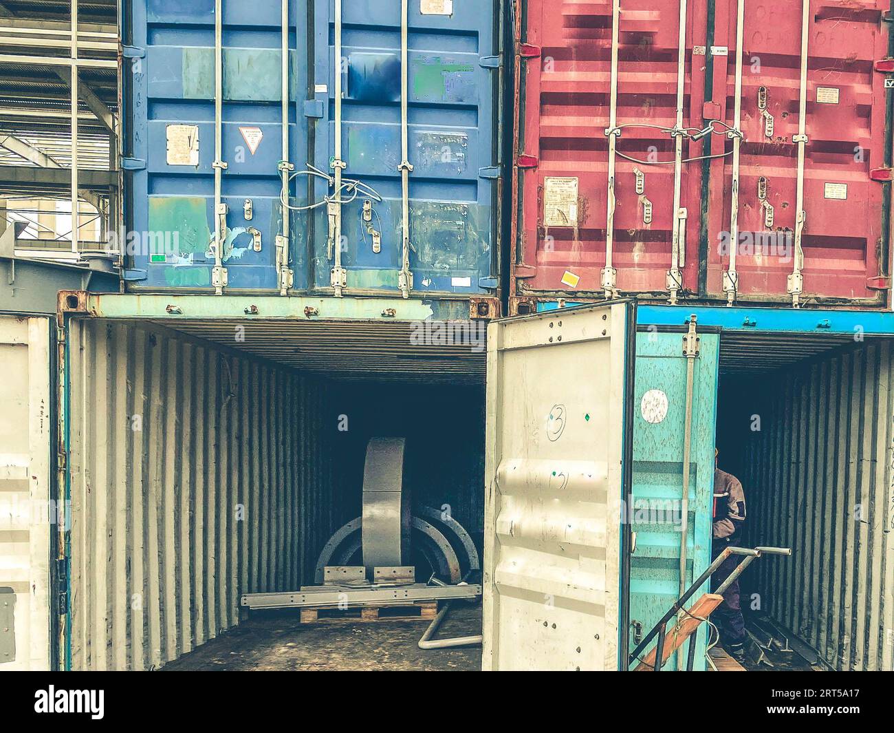 warehouse for building materials. multi-colored containers for ...