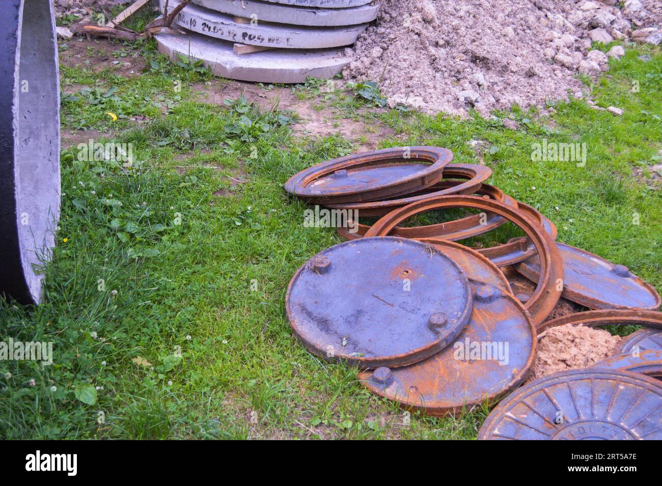 Iron construction manholes metal rusty round at a construction site ...