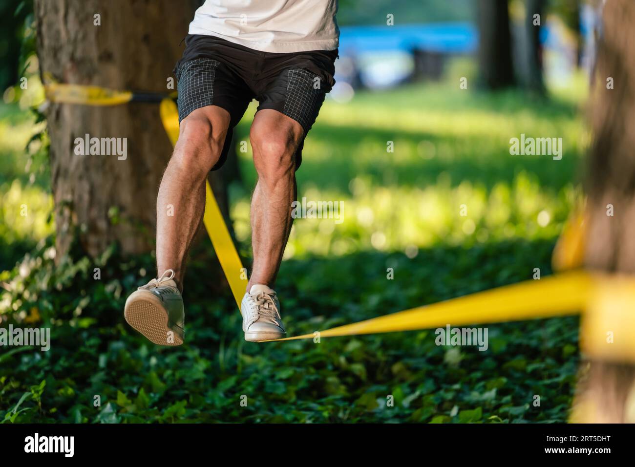 Close up picture of mans legs walking on the rope Stock Photo - Alamy