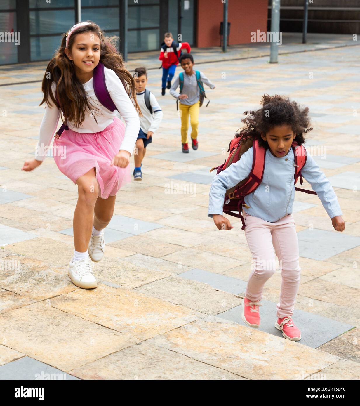 Group schoolchildren backpacks running hi-res stock photography and ...