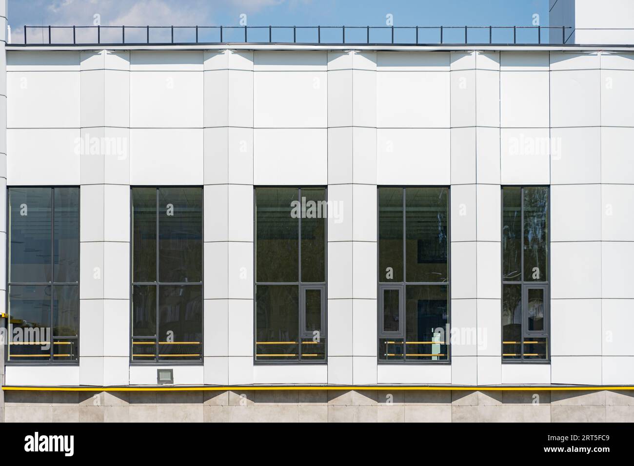 New building facade in housing complex. Modern style in architecture ...