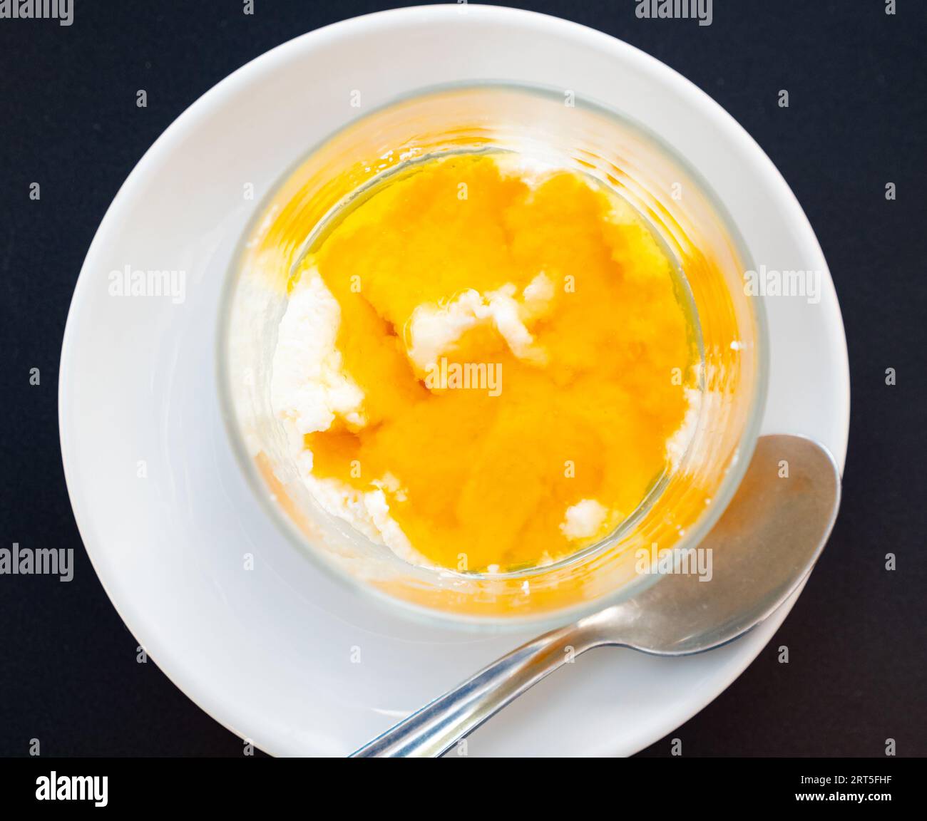 Fresh ship milk mato cheese with honey in glass Stock Photo - Alamy
