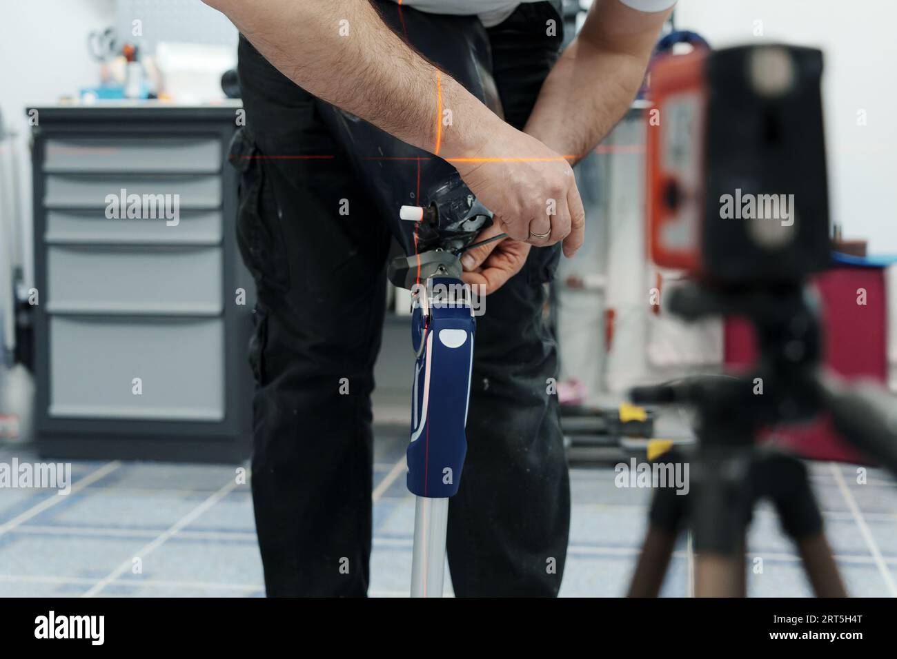 Crop unrecognizable craftsman adjusting and bending modern prosthetic ...