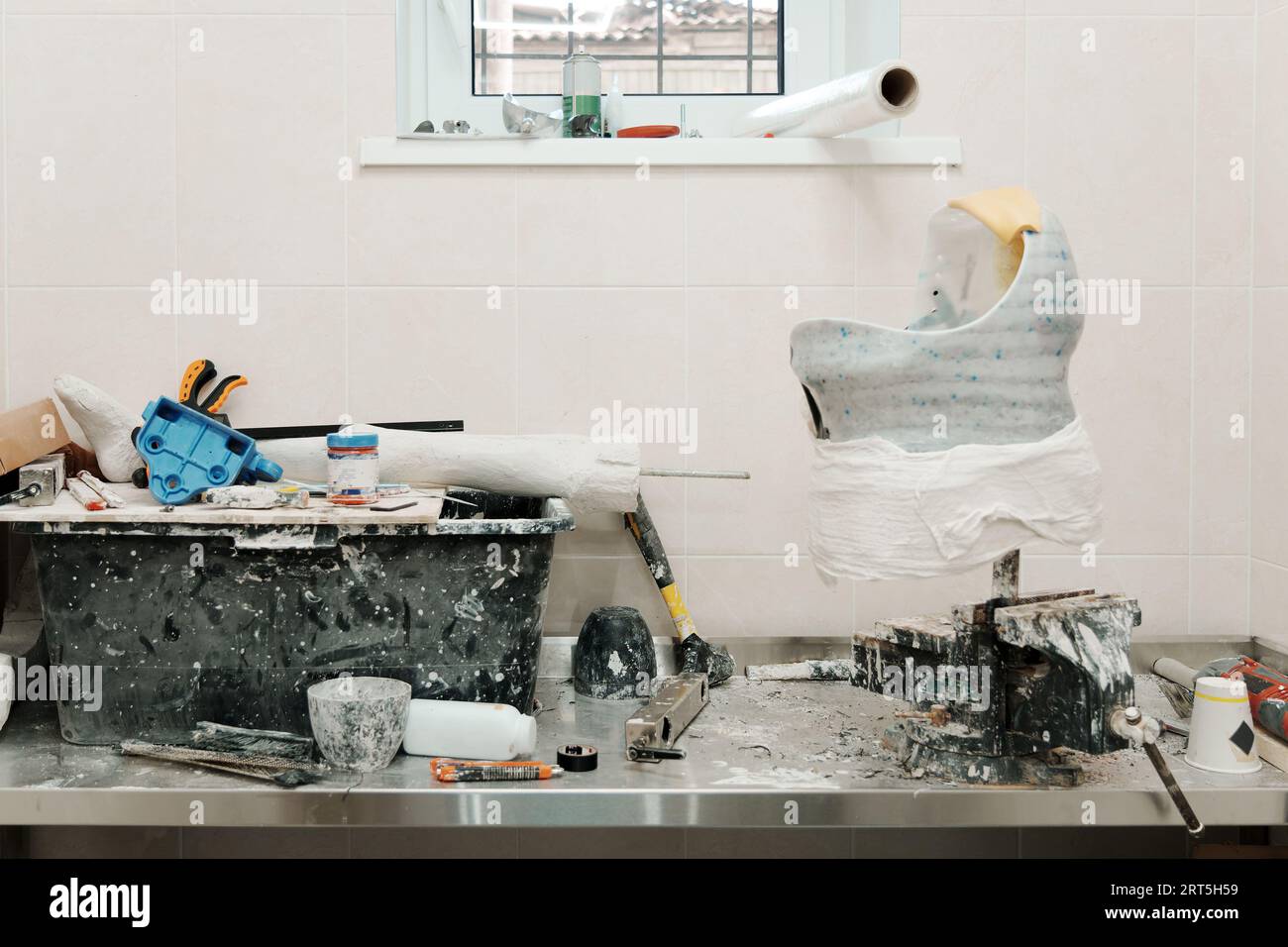 Hip disarticulation prosthesis mold with wet plaster Stock Photo - Alamy