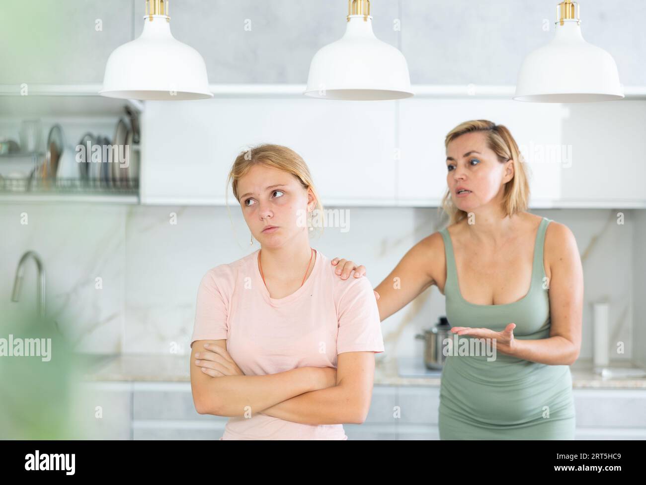 Angry mother yells at teenage girl sad daughter Stock Photo - Alamy