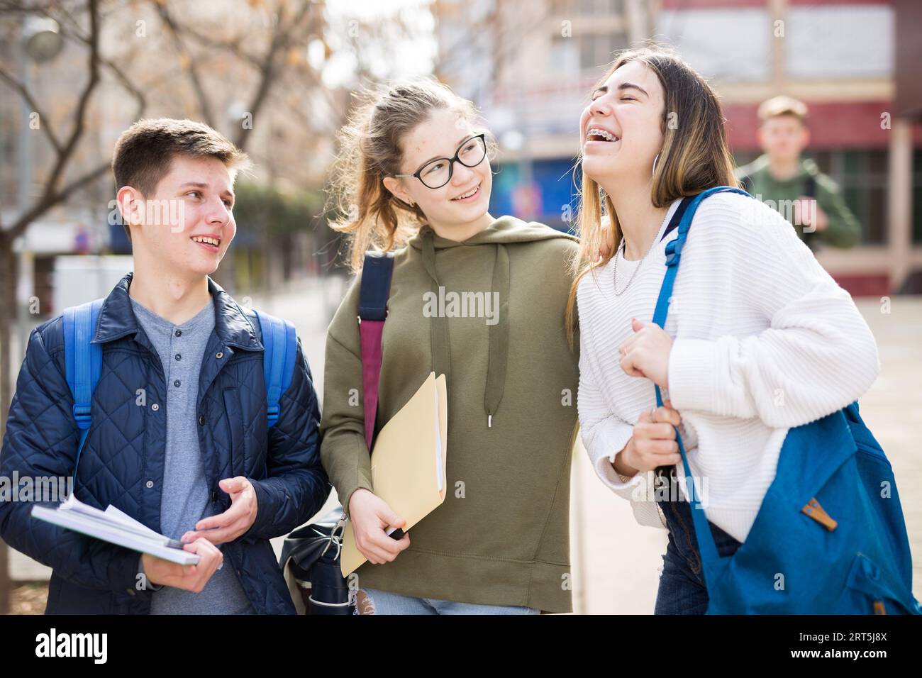 Teenage students talking outside after lessons Stock Photo - Alamy