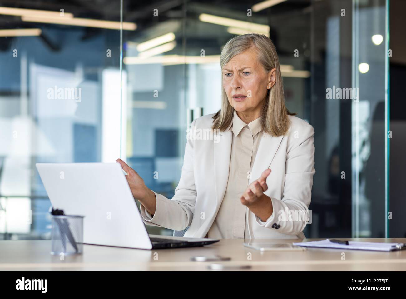 Dissatisfied and disappointed senior gray haired business woman at ...