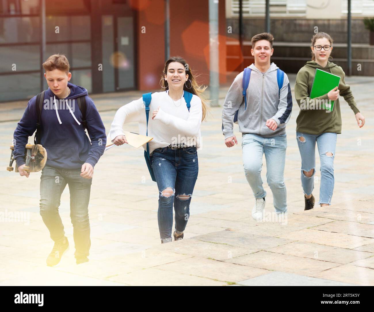 Teenager school kids running Stock Photo - Alamy